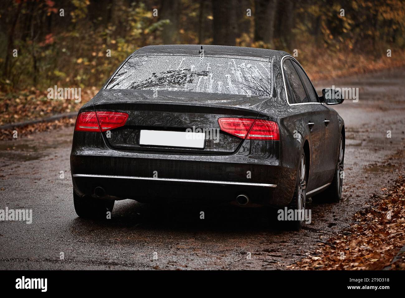 Modern black car driving on the road, city car background Stock Photo ...