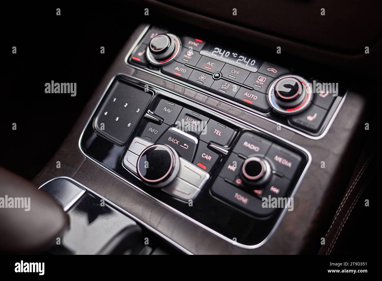 Shift lever, car steering wheel and sensors. Inside a modern car view ...