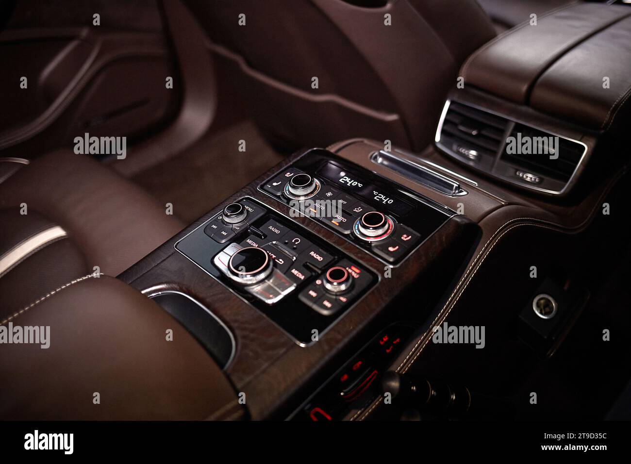 Shift lever, car steering wheel and sensors. Inside a modern car view ...