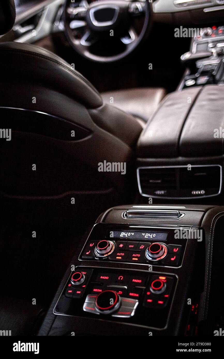 Shift lever, car steering wheel and sensors. Inside a modern car view ...