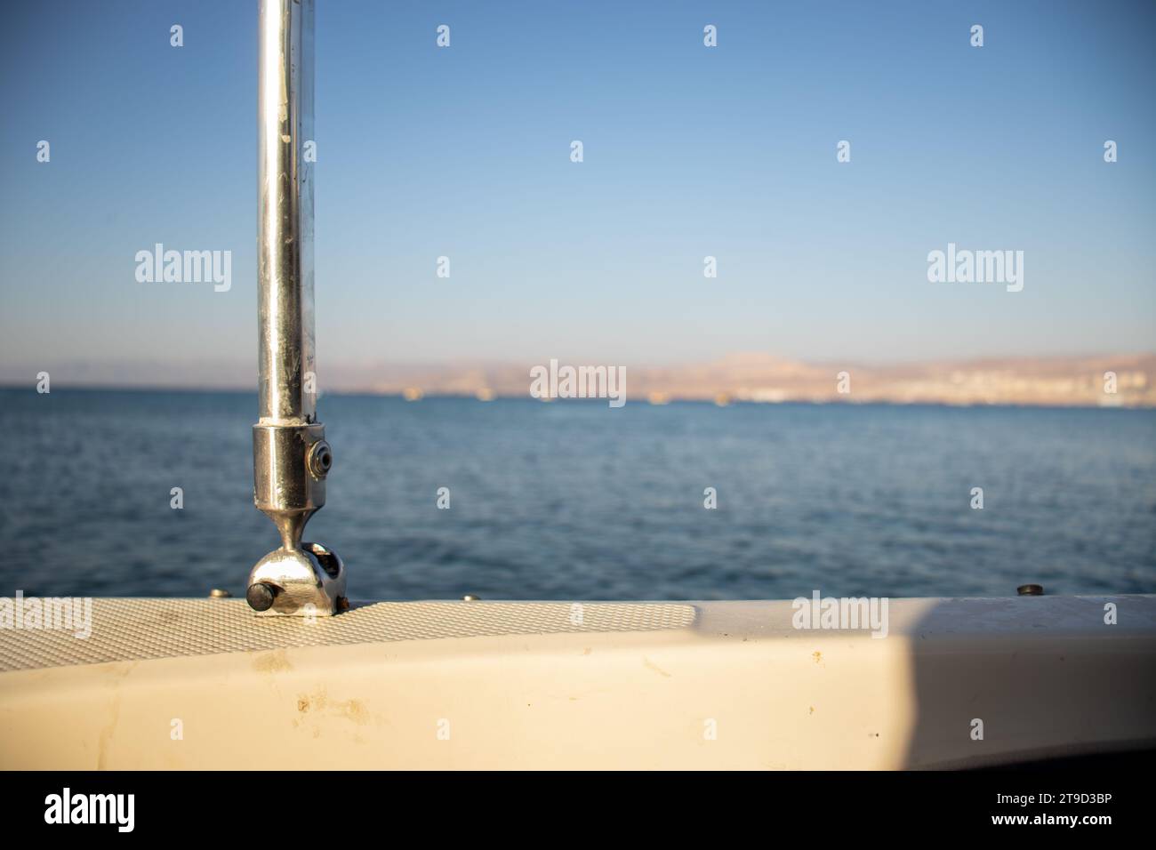 Ball and joint for ship holder with sea in the background as ...