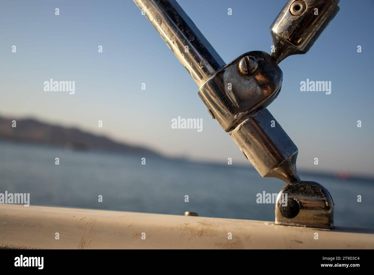 Ball and joint for ship holder with sea in the background as ...