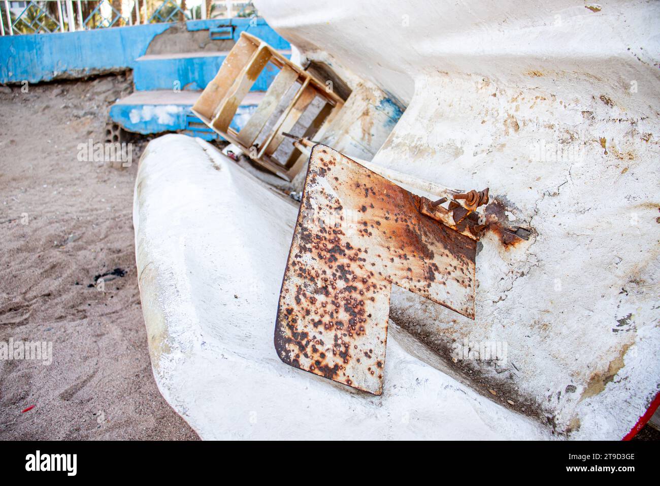 old rustic Ship's steering fin atached to plastic white old boat Stock ...