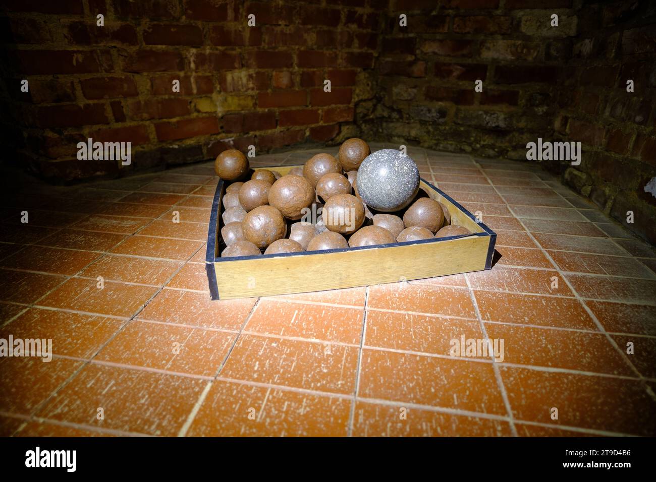 the balls of ancient medieval cannons are piled in a pile in the ...