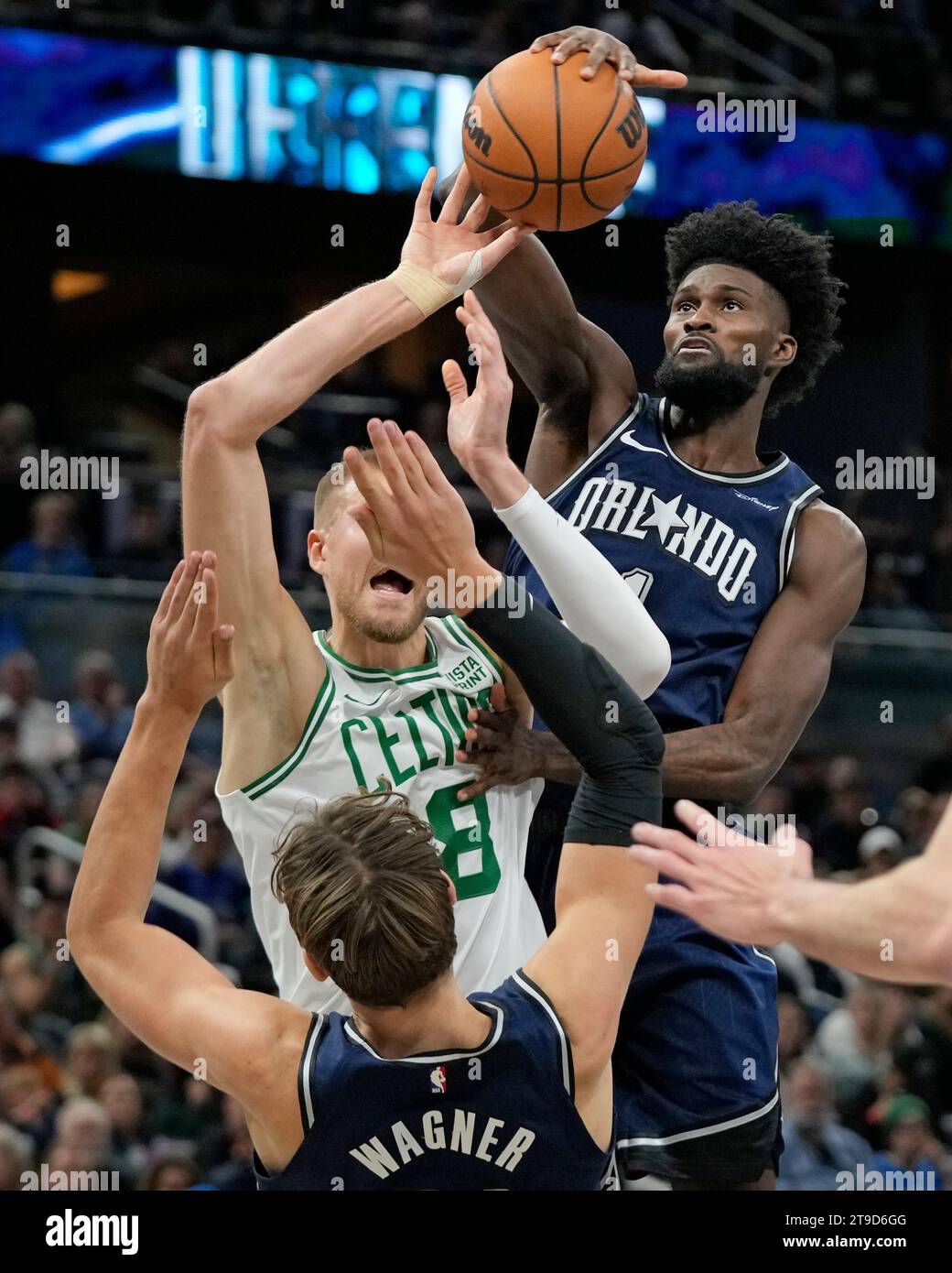 Orlando Magic forward Jonathan Isaac, right, blocks a shot attempt by ...