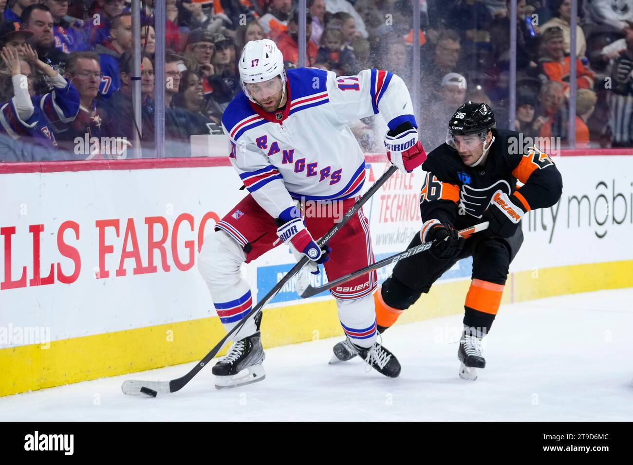 New York Rangers' Blake Wheeler, left, keeps the puck away from ...