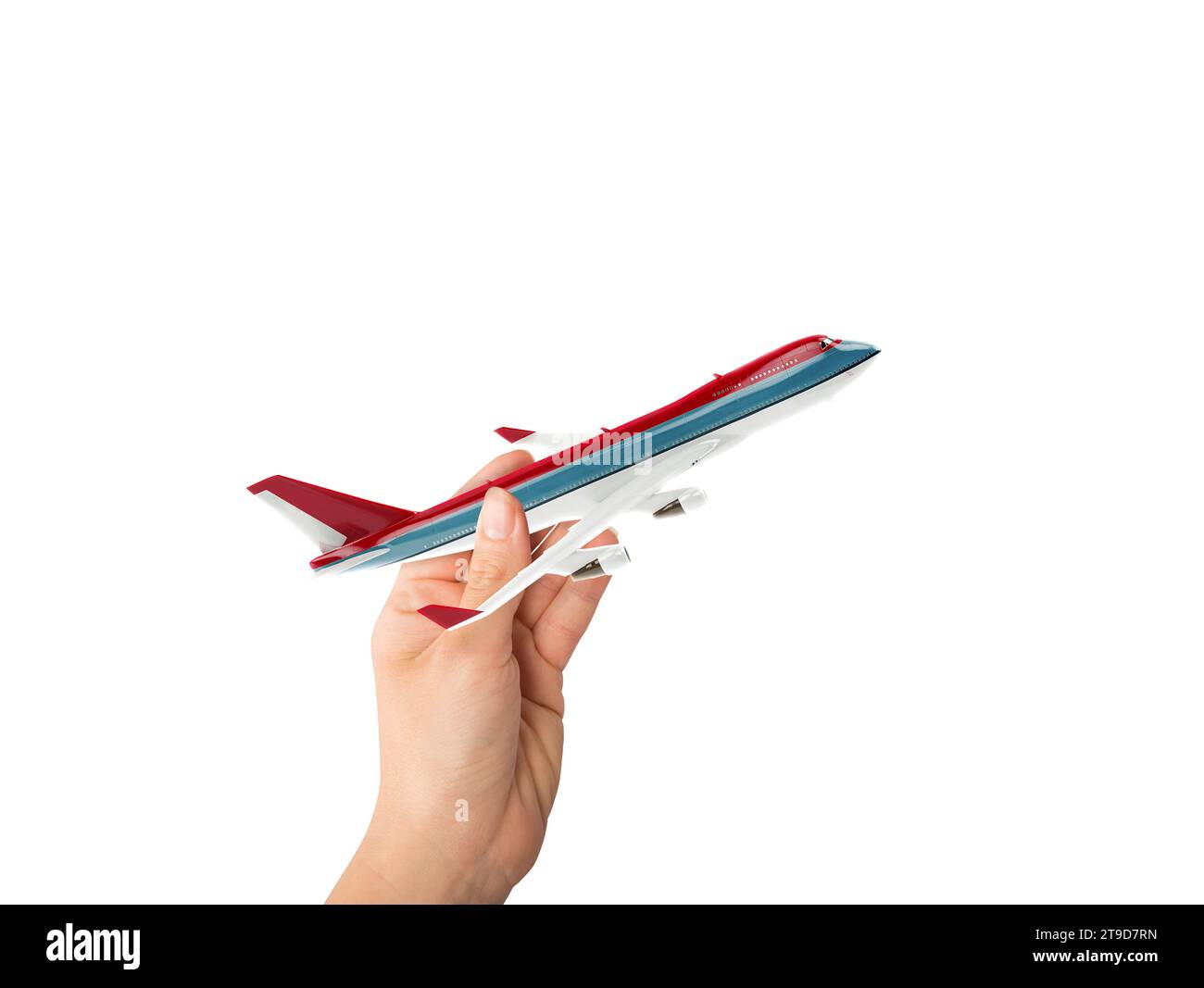 Hand holds a toy airliner ready to fly Stock Photo - Alamy