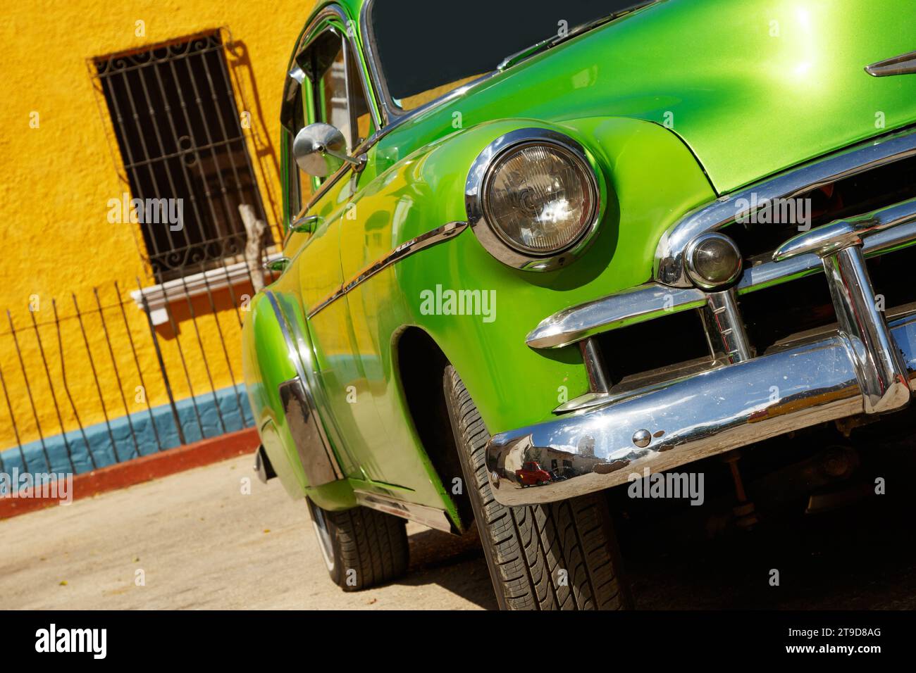 Front view of a shiny vintage green car parked on street Stock Photo ...