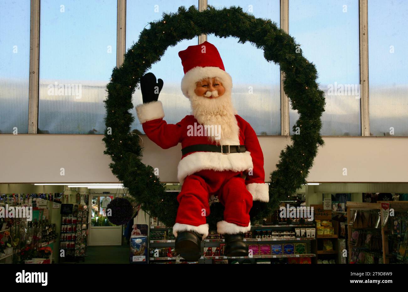 A view of Father Christmas swinging to and fro, above the entrance to ...
