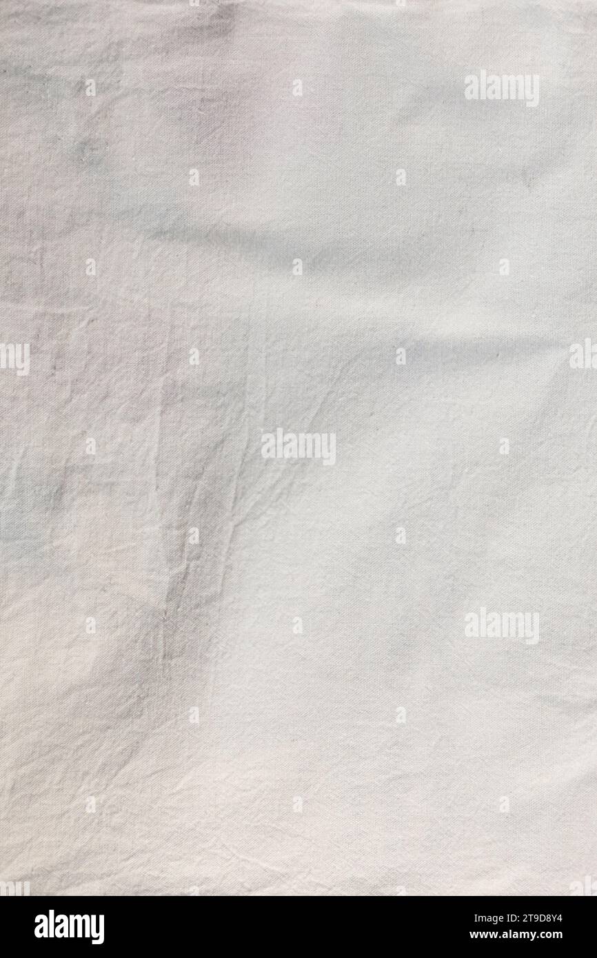 Eco-friendly natural material. White cotton fabric slightly wrinkled ...