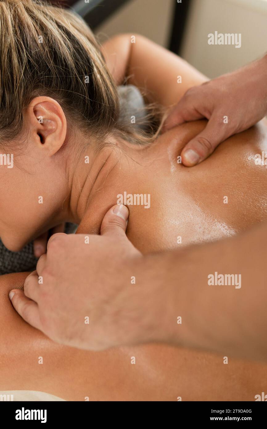 Closeup Of Masseur Mans Hands During Back Massage For His Woman Client