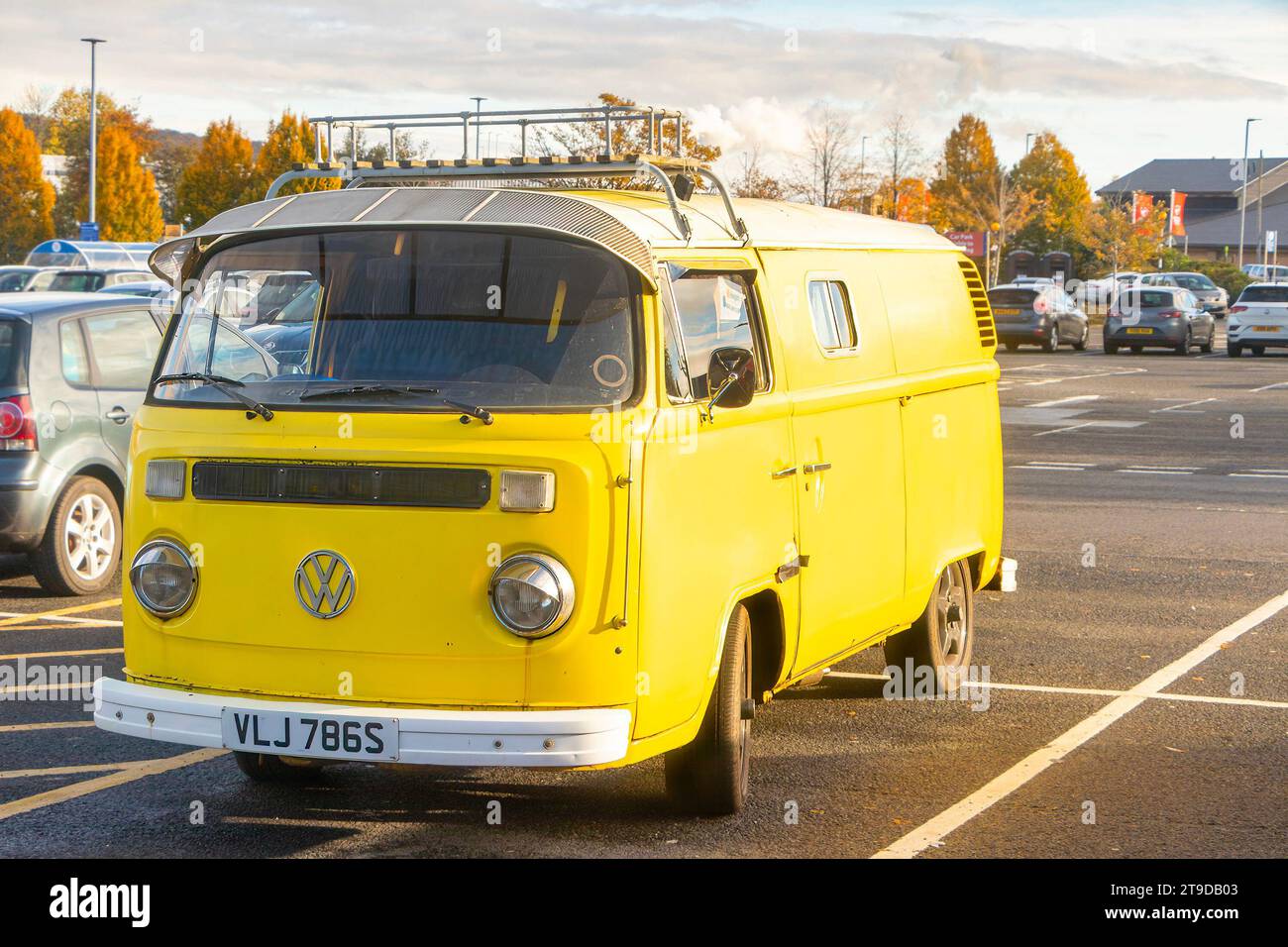 yellow vintage volkswagen type 2 classic VW campervan with roof rack in ...