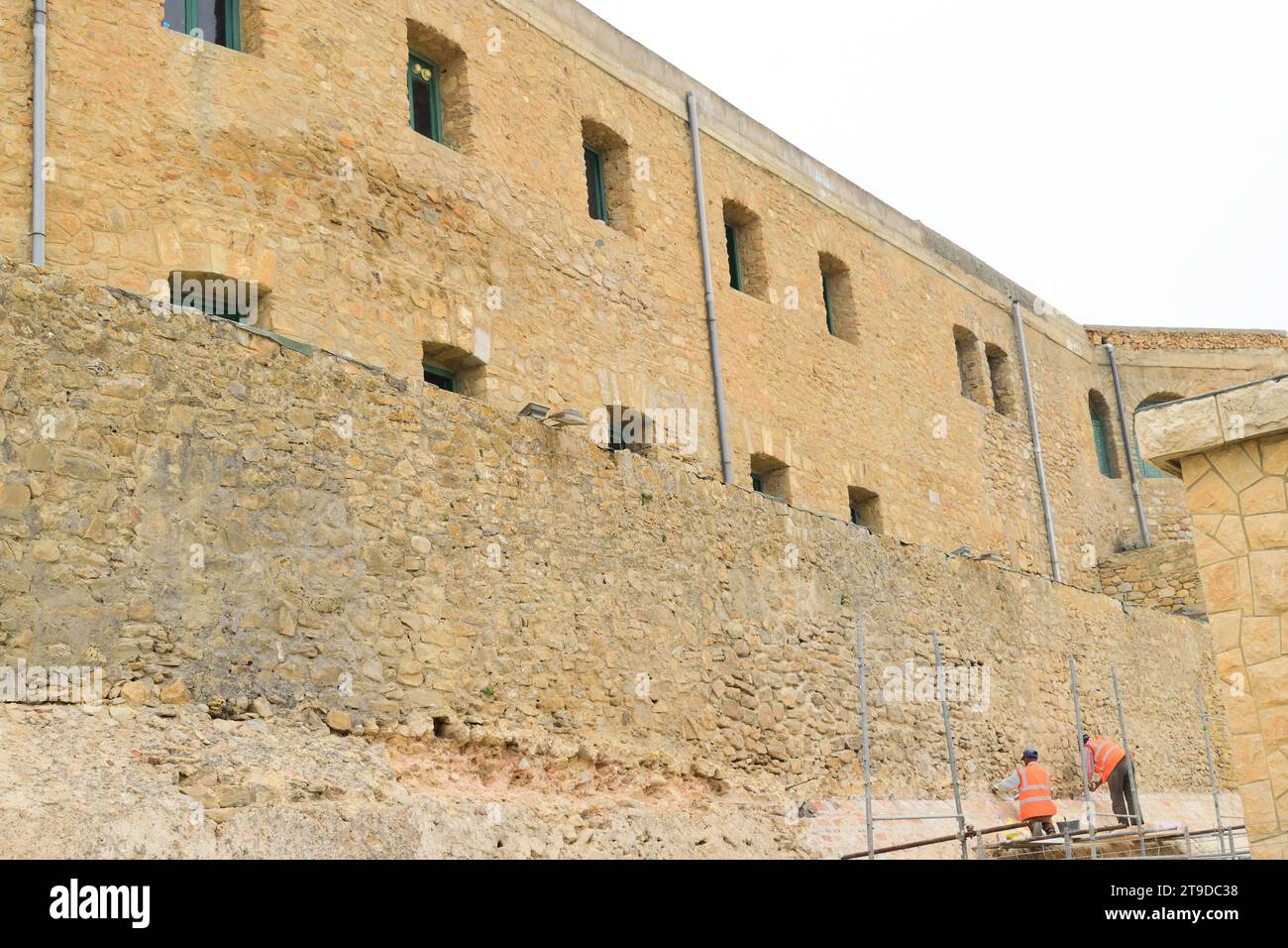 non edited picture of workers working on renewing and renovation of old ...