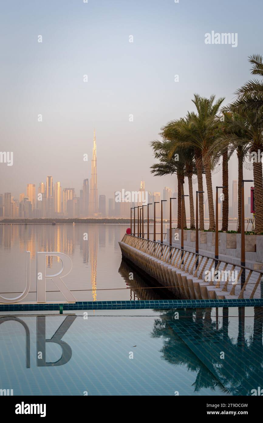 Dubai, UAE, 07.02.22. Dubai Creek Harbour turquoise water pool with row ...