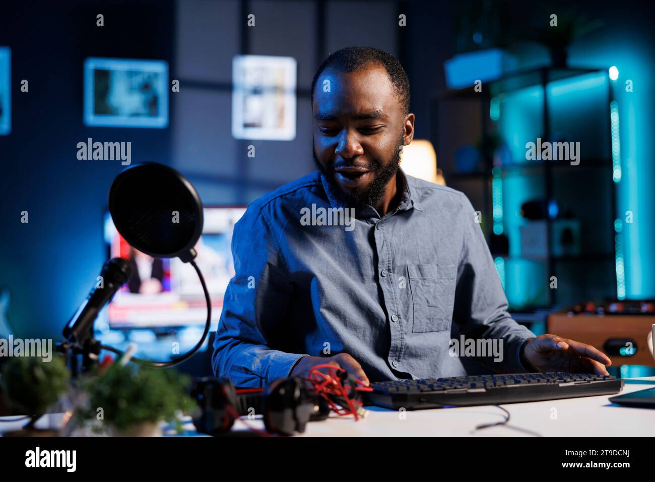Content creator typing on mechanical keyboard while doing review in ...