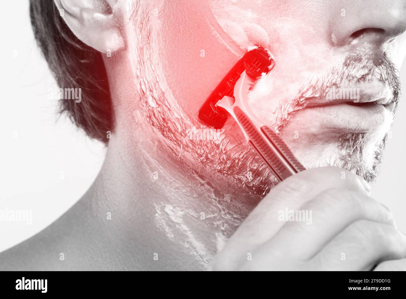 Man with sensitive skin during shaving routine with a safety razor ...