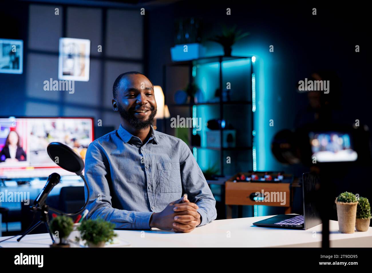 Smiling influencer preparing to start recording content for social ...