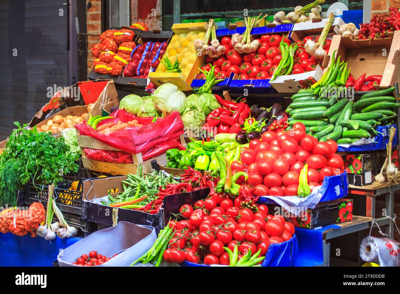 Summer city landscape - view of the counter with vegetables near the ...