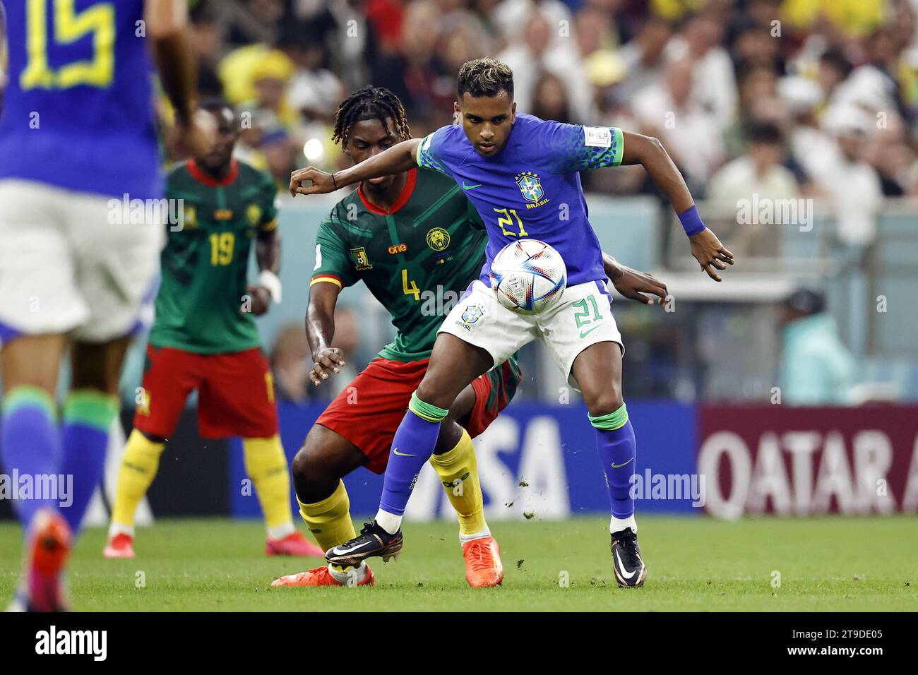 LUSAIL CITY - (L-R) Christopher Wooh of Cameroon, Rodrygo of Brazil ...