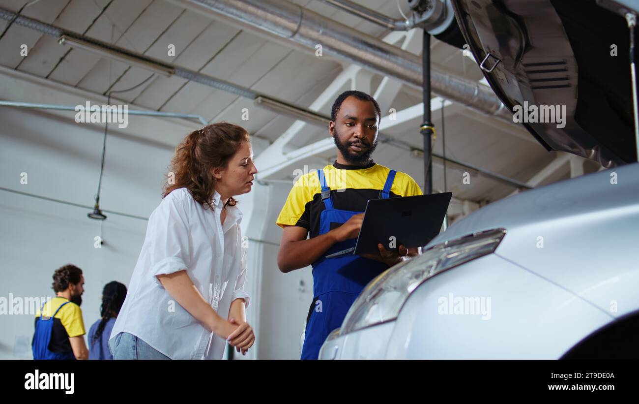 Car mechanic using torque wrench hi-res stock photography and images ...