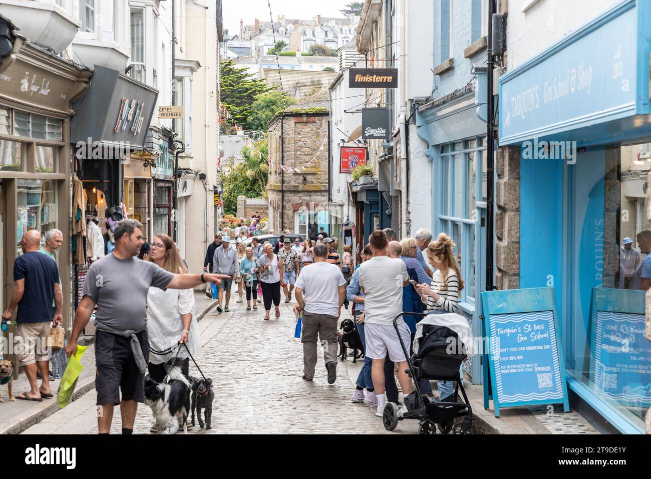 St Ives town centre in Cornwall, people shopping and walking through ...