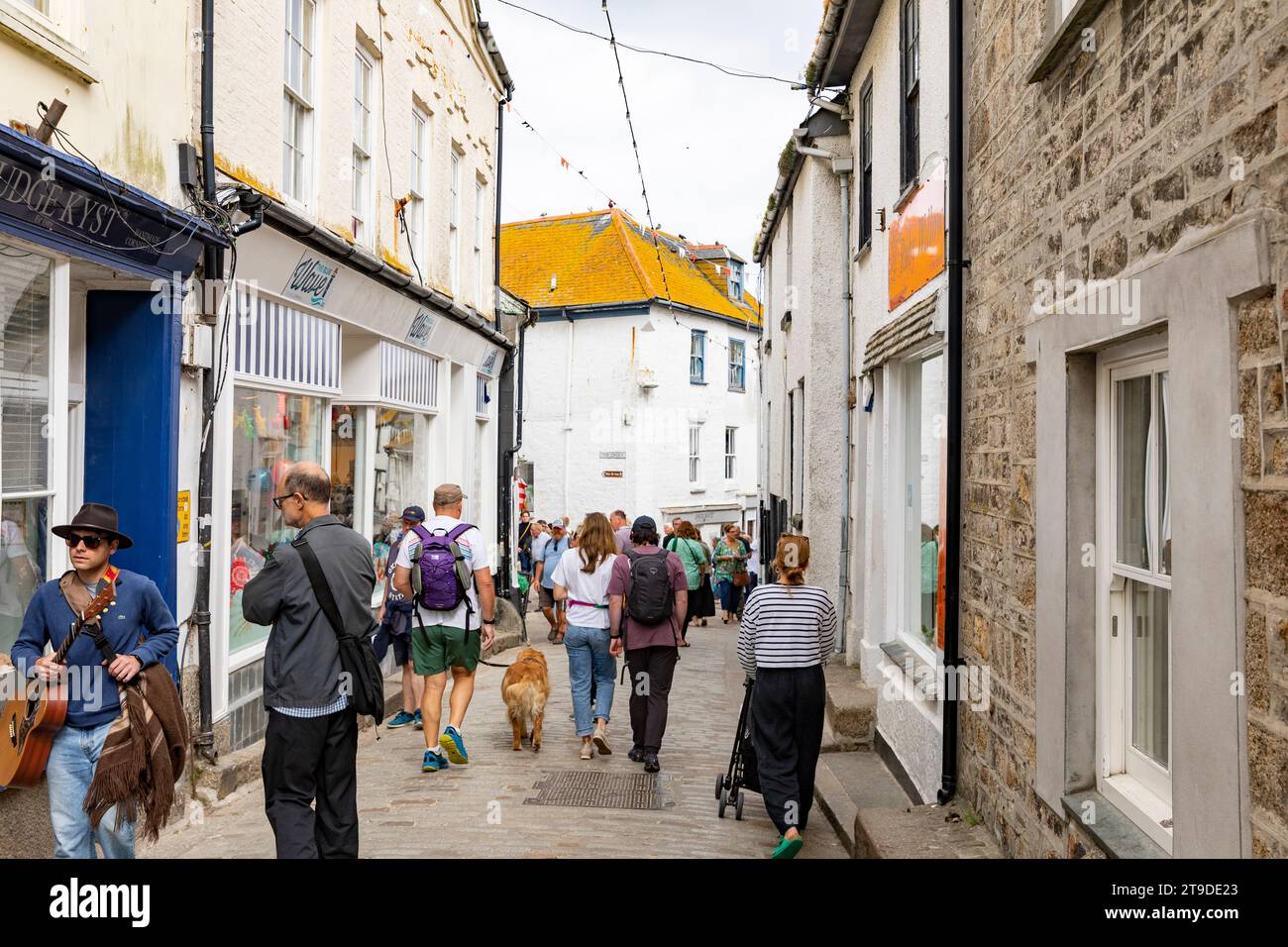 St Ives town centre in Cornwall, people shopping and walking through ...