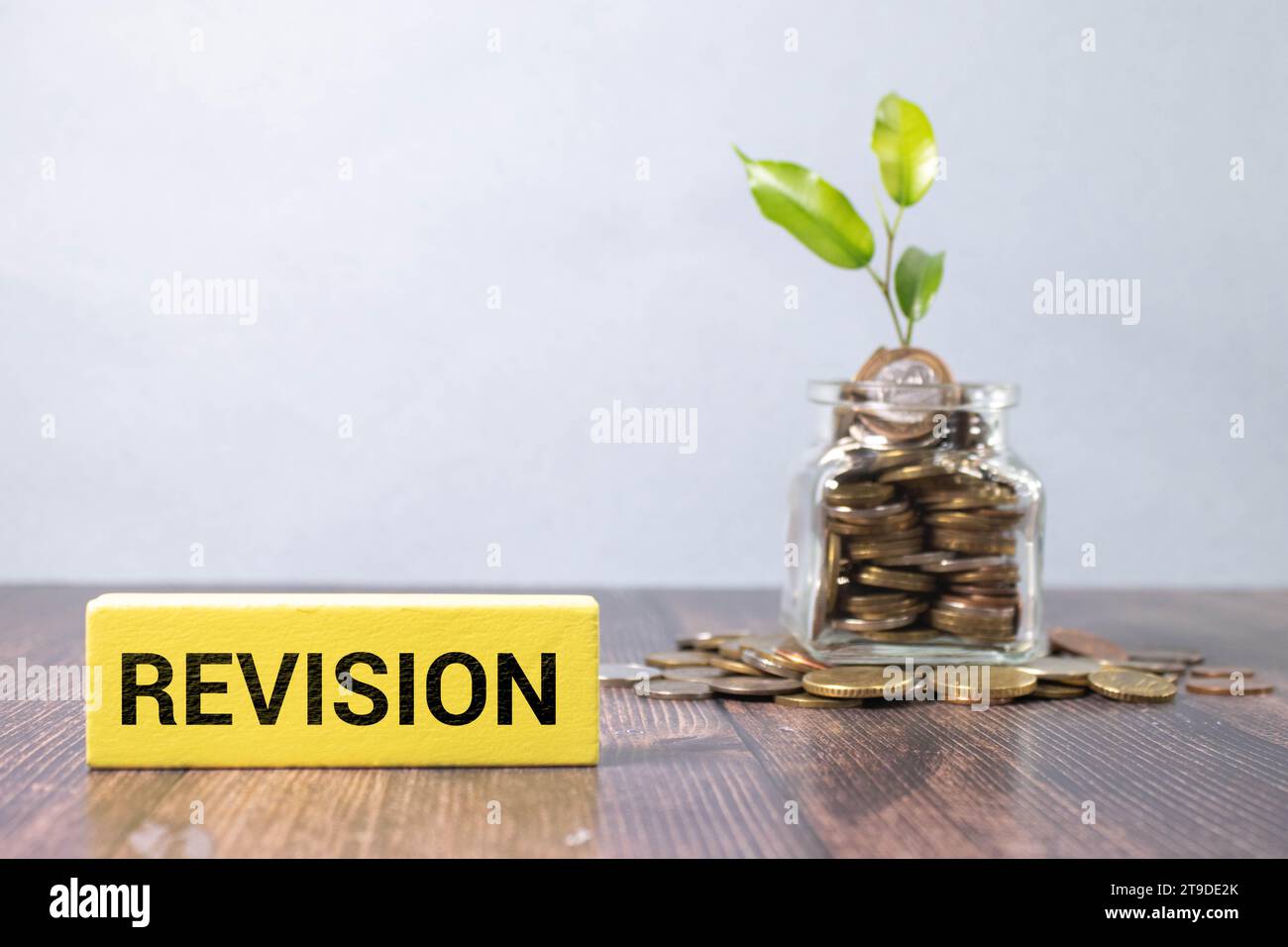 revision word made from metallic letterpress on dark jeans background ...