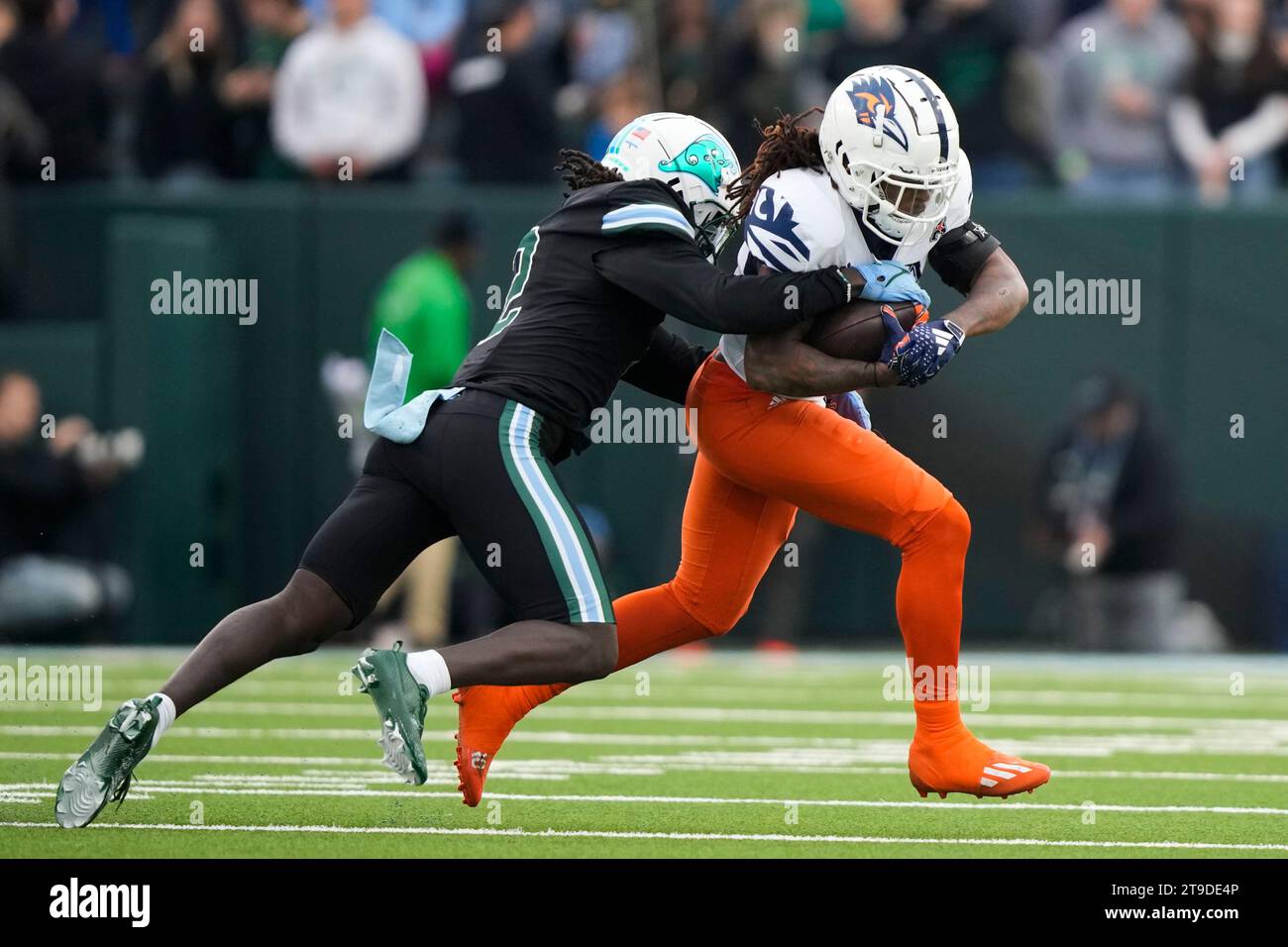 UTSA running back Robert Henry carries against Tulane defensive back ...