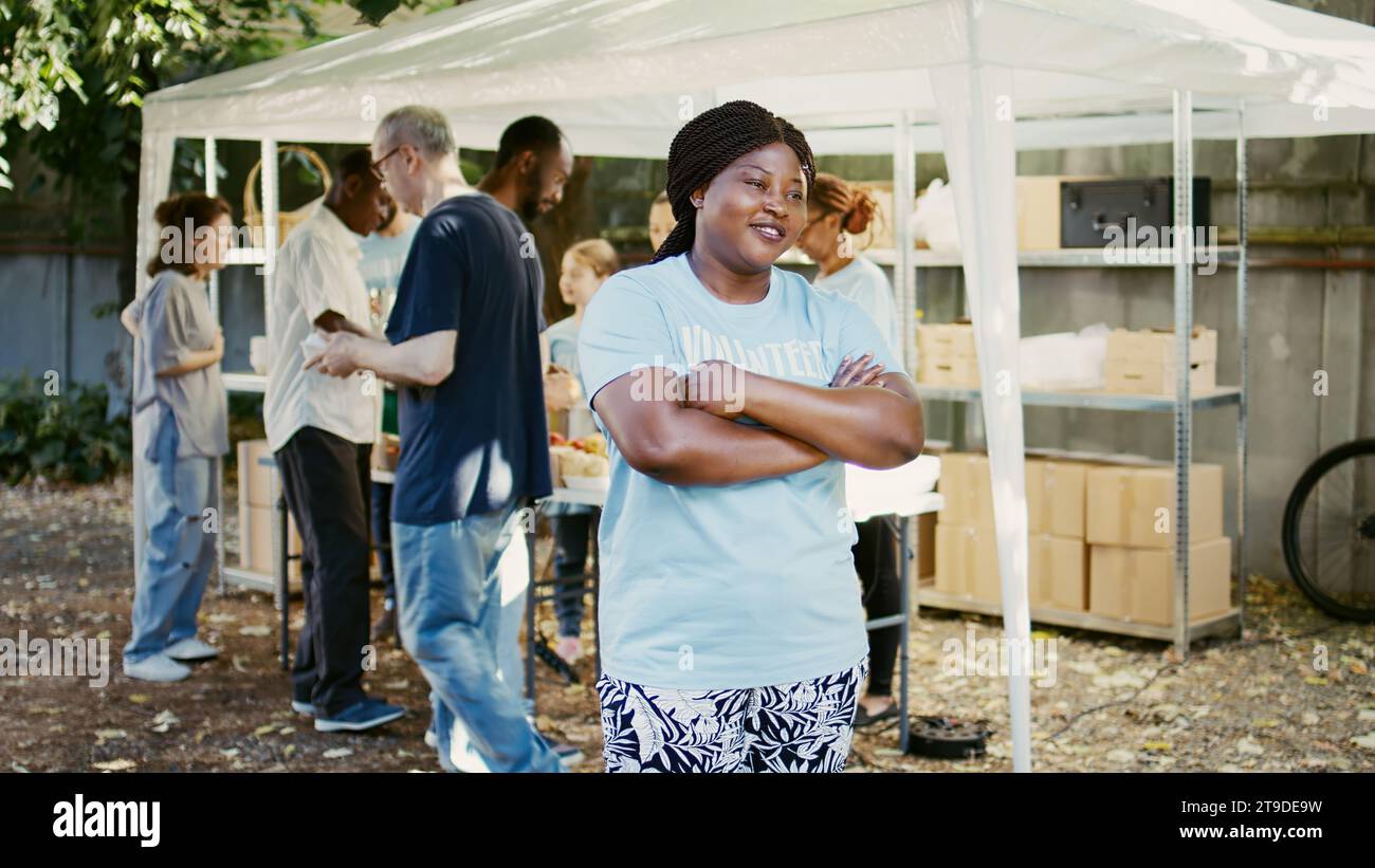 Enthusiastic black female volunteer, ready to provide humanitarian aid ...