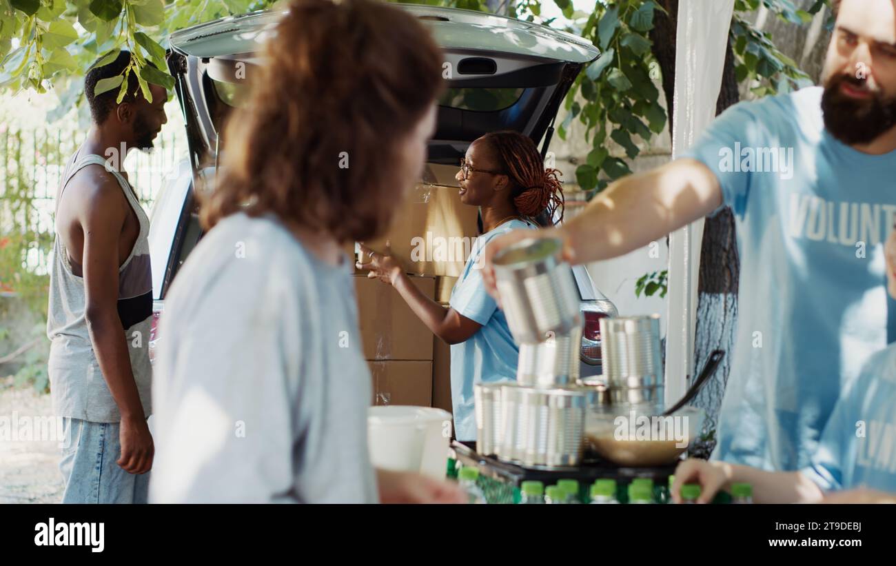 Humanitarian aid team provides support to poor homeless people with ...