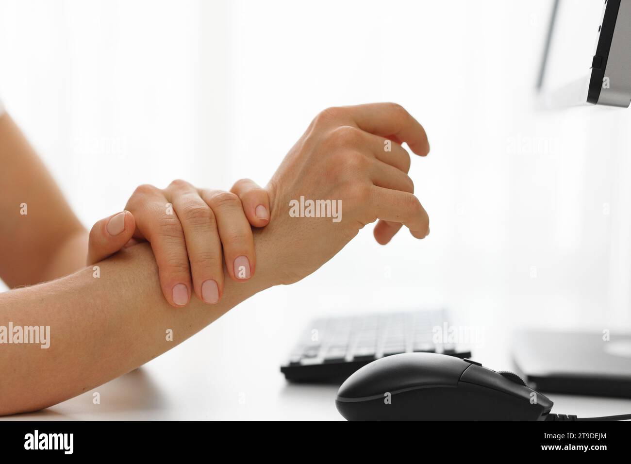 Closeup of female hands with a pain in the wrist because of carpal ...