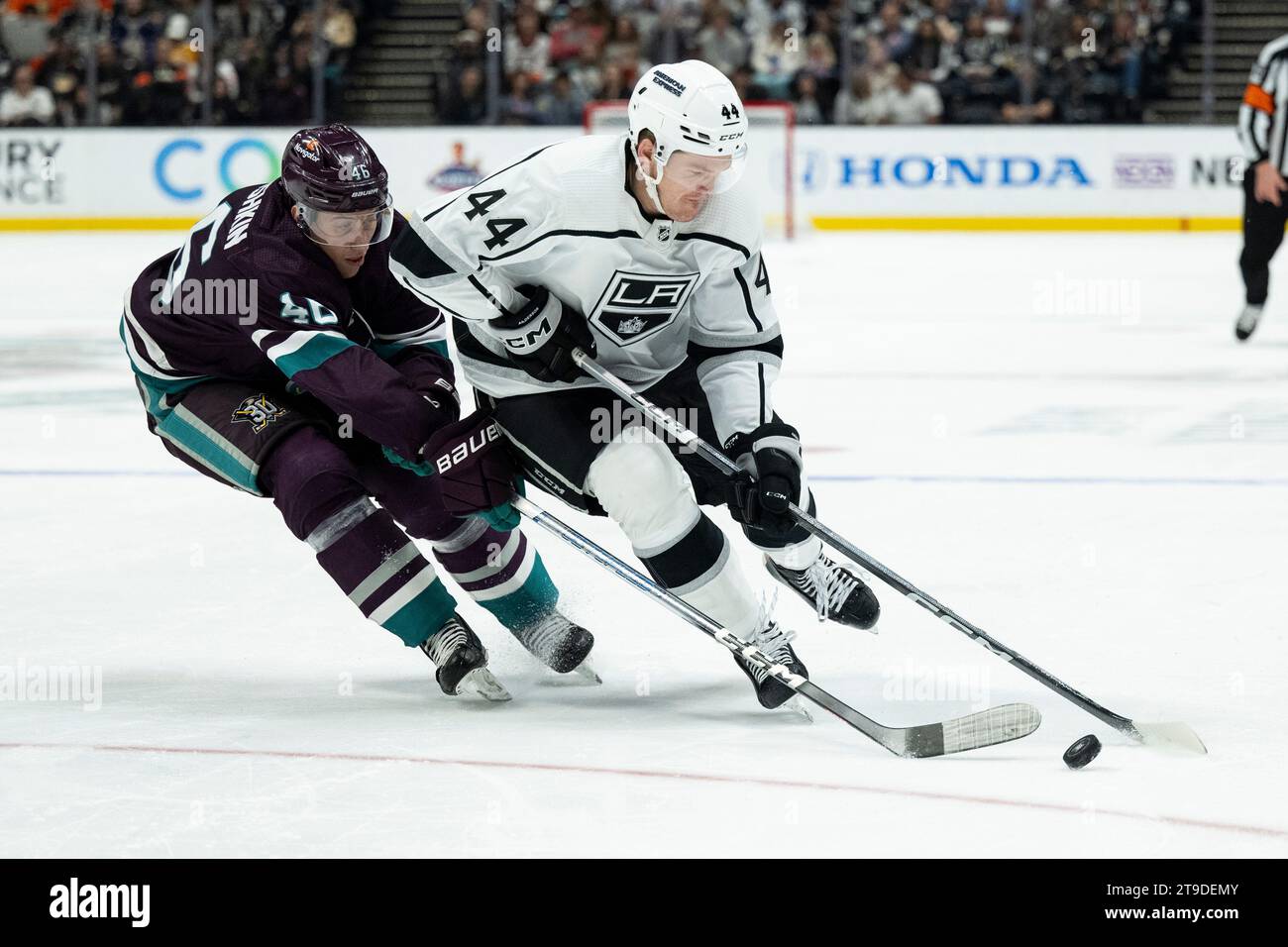 Los Angeles Kings defenseman Mikey Anderson (44) controls the puck as ...