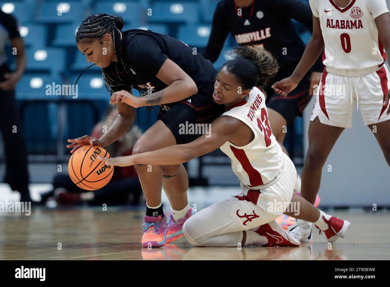 Louisville forward Nyla Harris, left, tries to keep the ball as Alabama ...