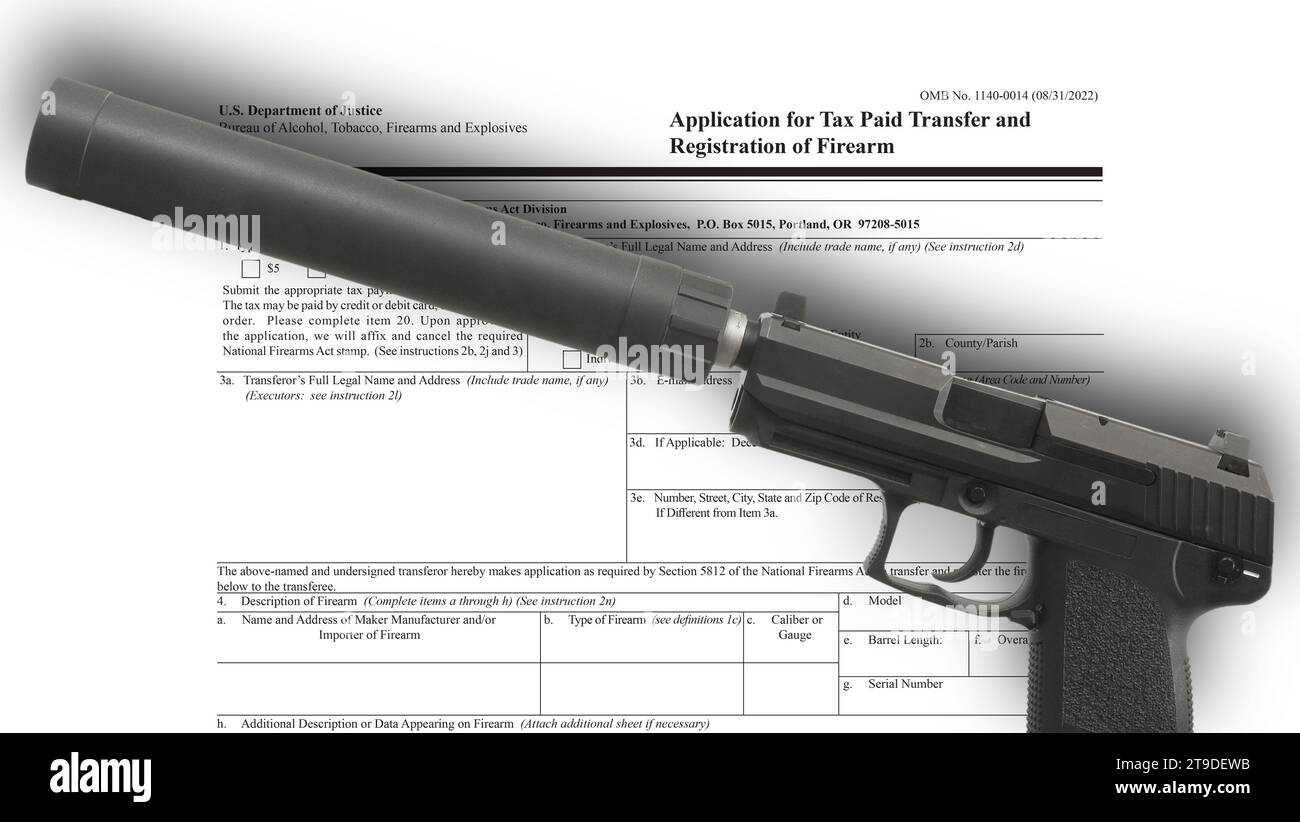 Shadow behind a silencer and pistol with the ATF public domain form to ...