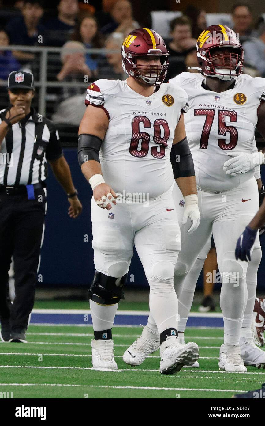 Washington Commanders center Tyler Larsen (69) walks to the line of ...