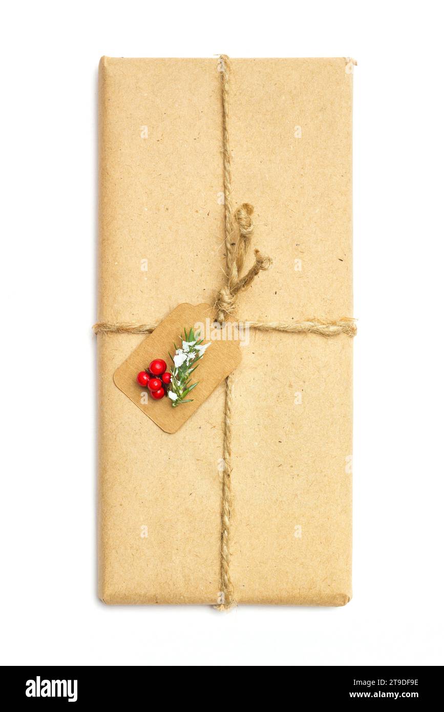 View of a Christmas present in homemade craft paper packaging on an ...