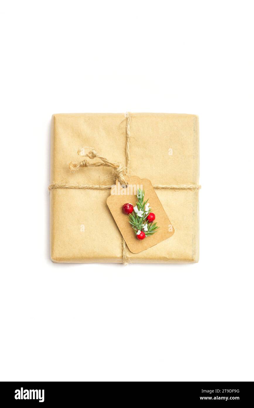 View of a Christmas present in homemade craft paper packaging on an ...