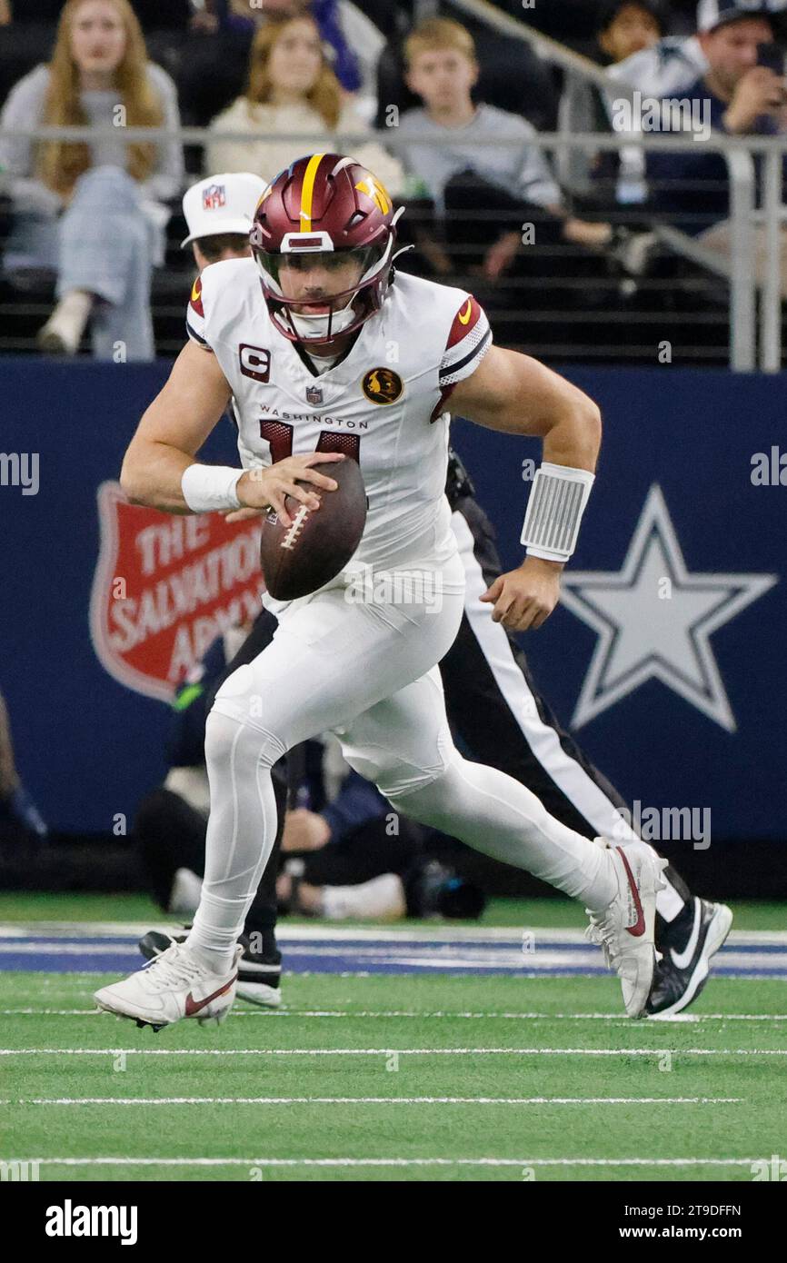 Washington Commanders quarterback Sam Howell scrambles with ball during ...