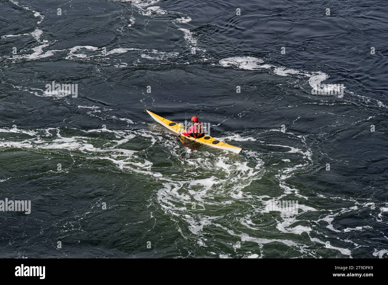 Canoe on fast flowing sea water at Oban in Scotland Stock Photo - Alamy
