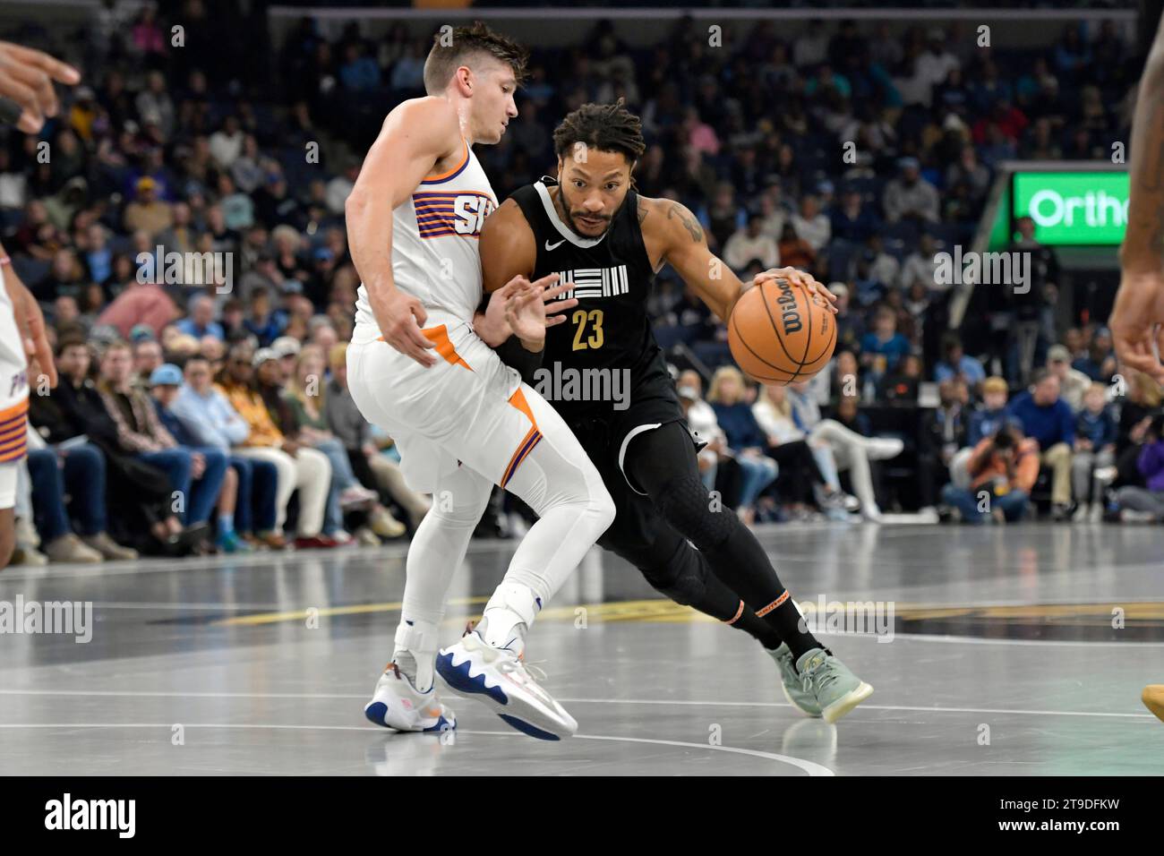 Memphis Grizzlies guard Derrick Rose (23) drives against Phoenix Suns guard Grayson Allen, left ...