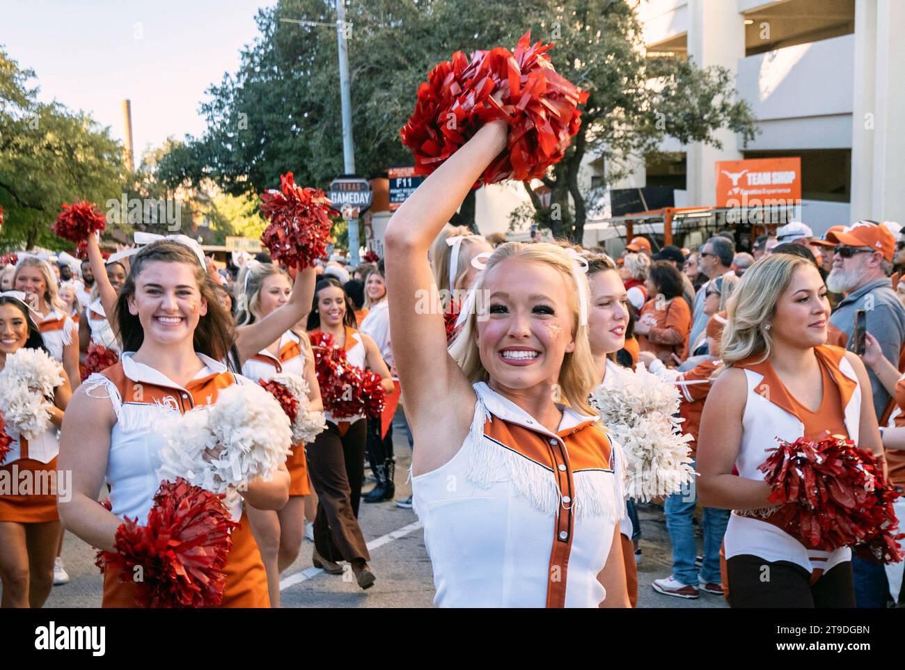 Texas cheerleaders parade toward the Darrell K. Royal - Texas Memorial ...