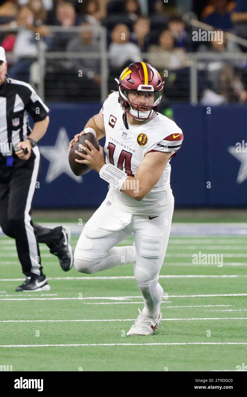 Washington Commanders quarterback Sam Howell (14) scrambles during an ...