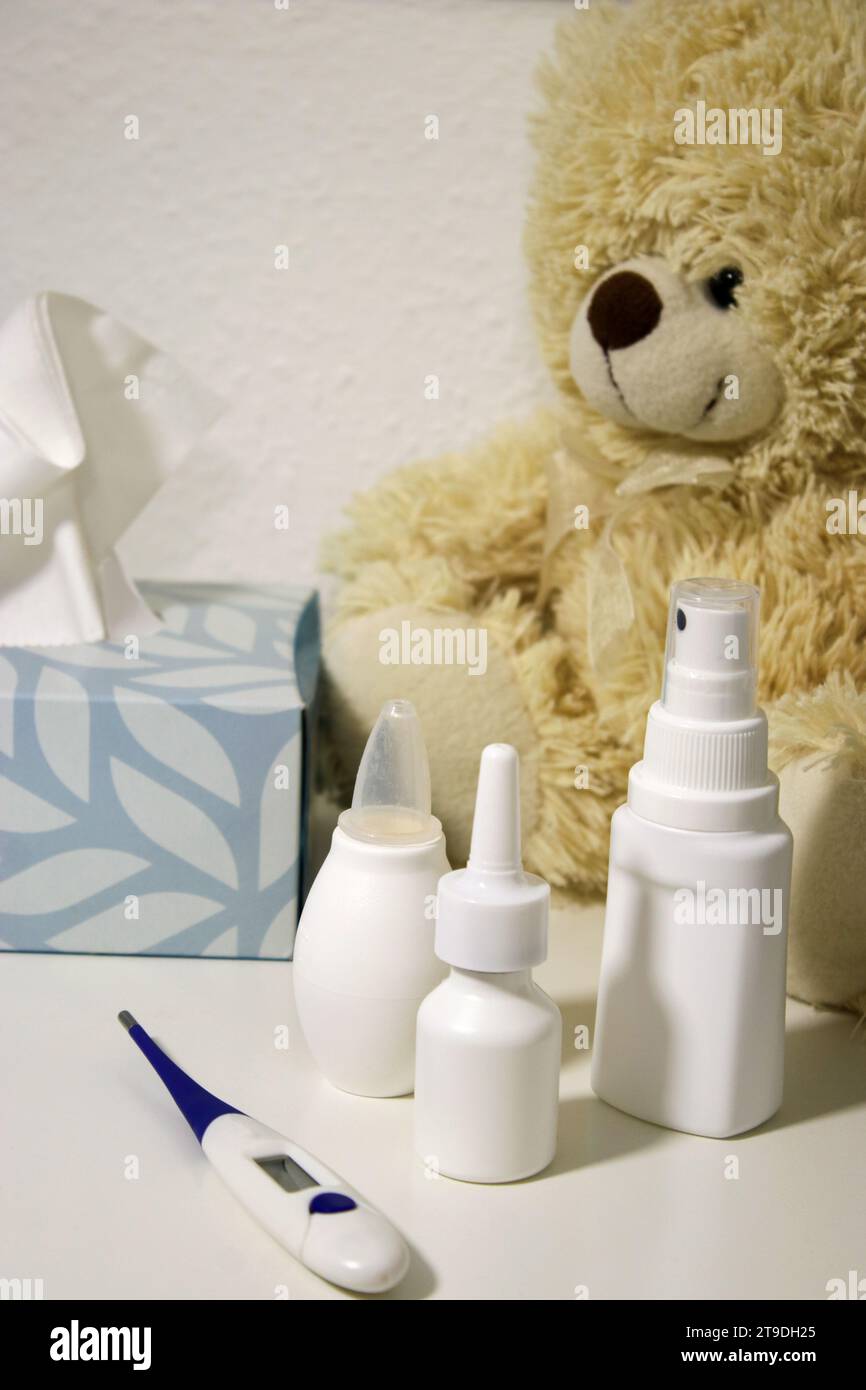 Flue Medicine Bottles And A Thermometer On White Table With A Teddy
