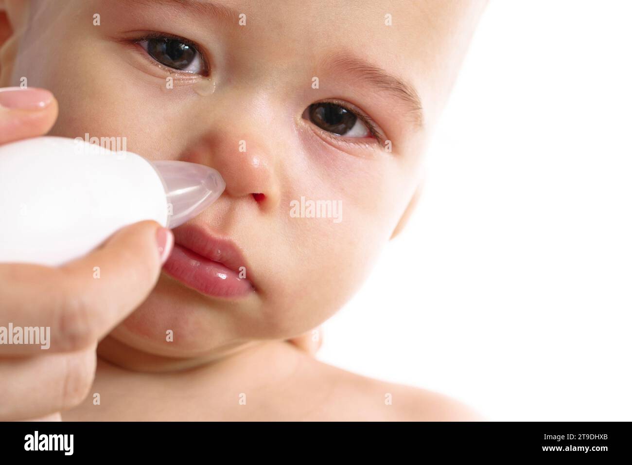 Mother Is Using Nasal Aspirator To Suck Snot Out Of Her Son S Nose On