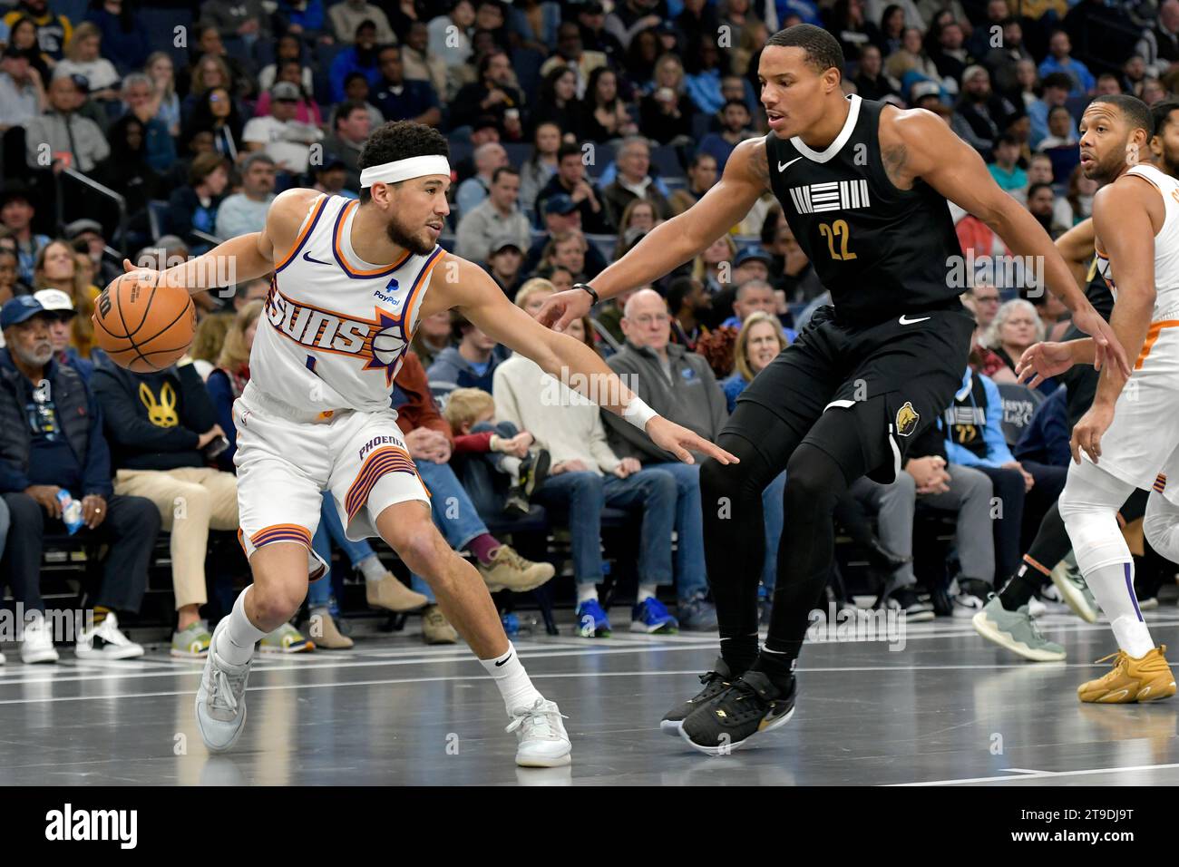 Phoenix Suns guard Devin Booker (1) is defended by Memphis Grizzlies ...