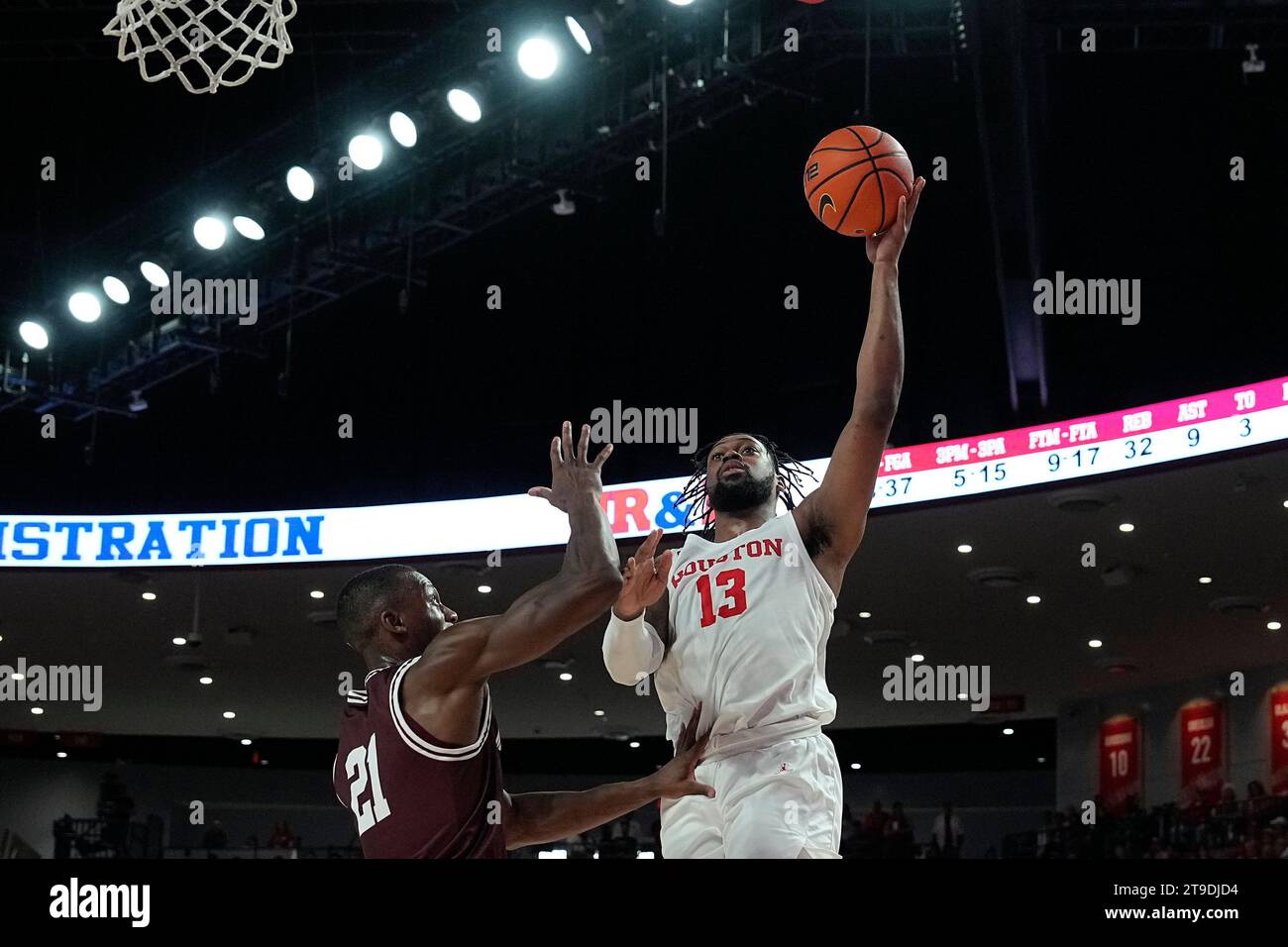 Houston forward J'Wan Roberts (13) shoots over Montana forward Laolu ...