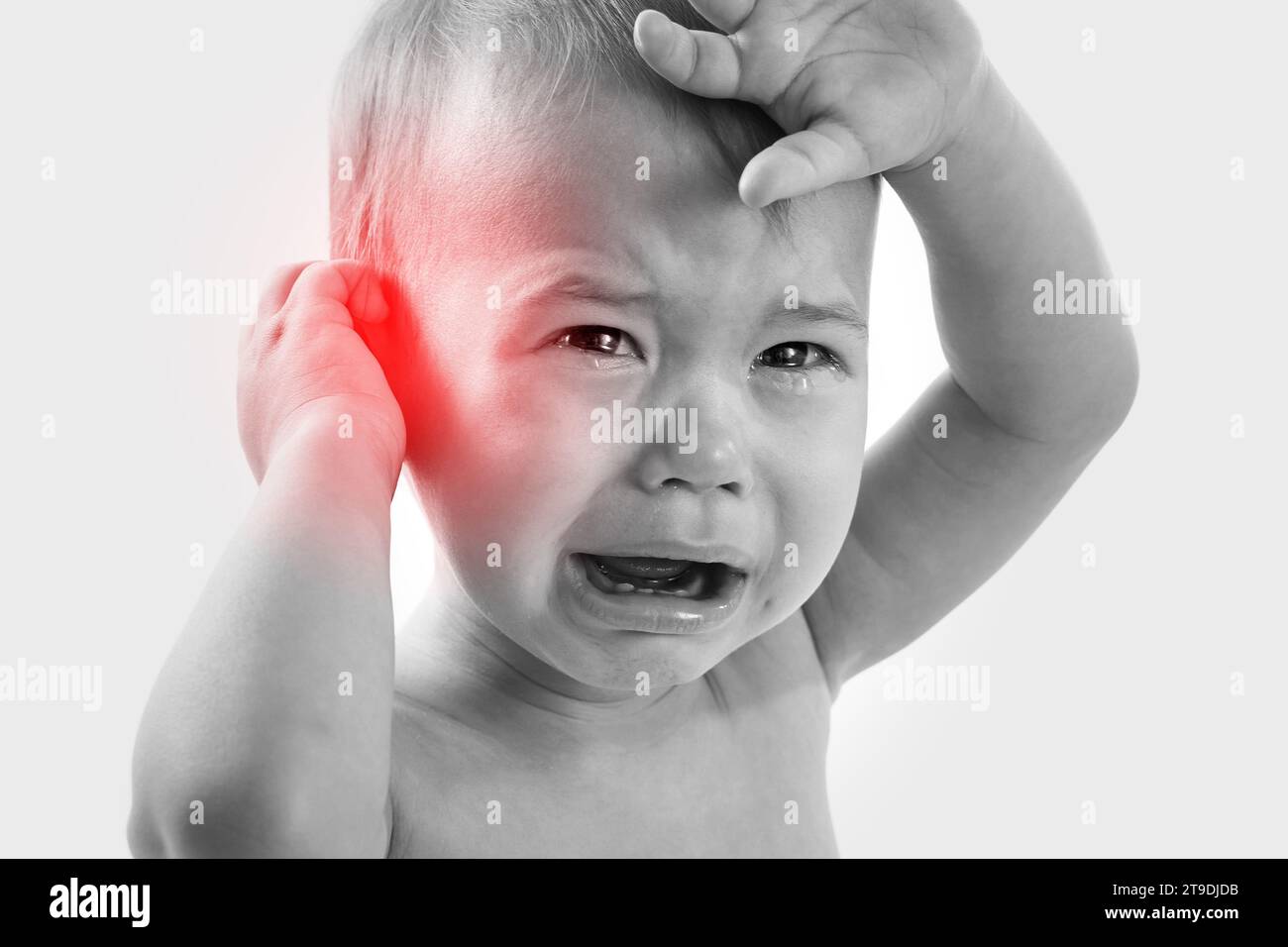 Closeup of little crying baby suffering from a ear pain Stock Photo - Alamy
