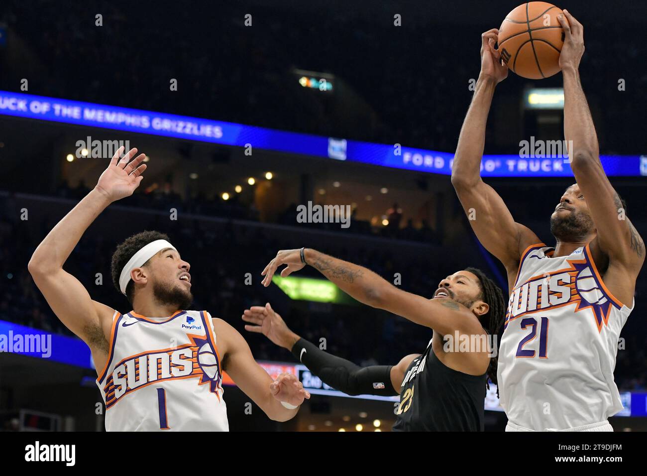 Phoenix Suns forward Keita Bates-Diop (21) grabs a rebound over Memphis ...