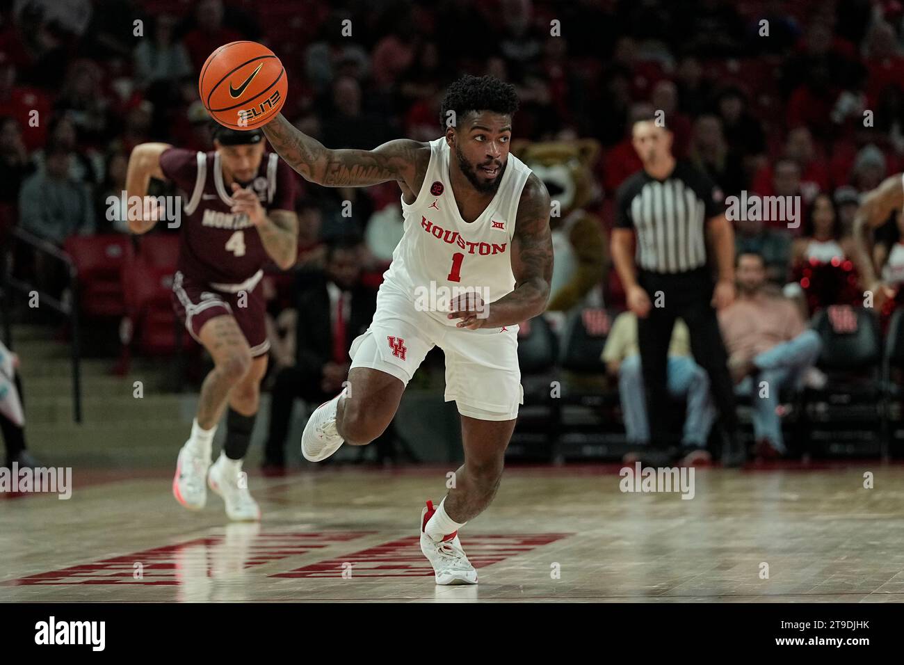 Houston guard Jamal Shead (1) drives up court on a fast break after a ...
