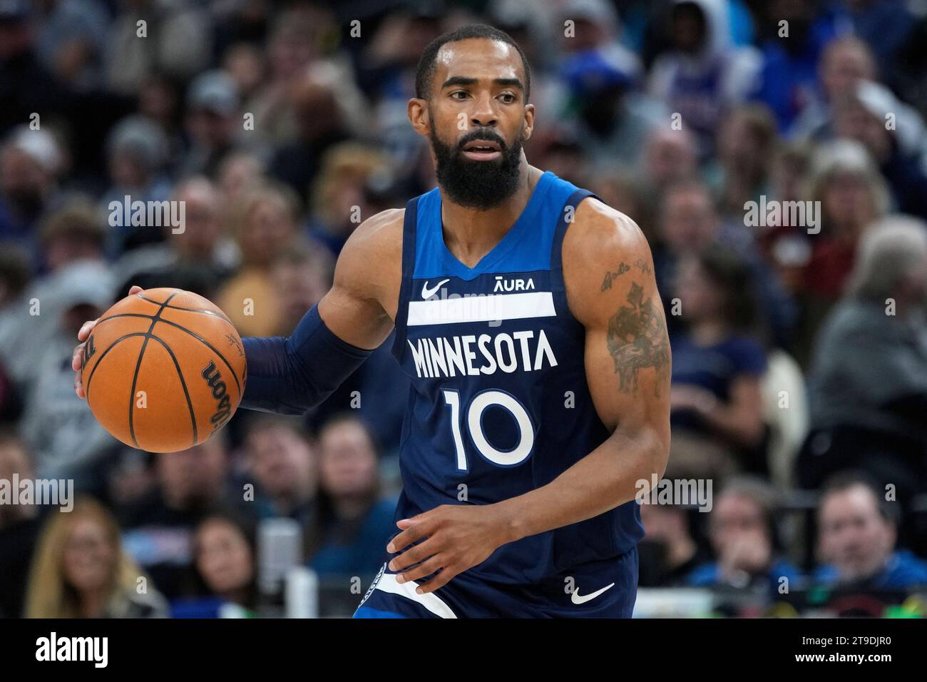 Minnesota Timberwolves guard Mike Conley (10) dribbles down the court ...